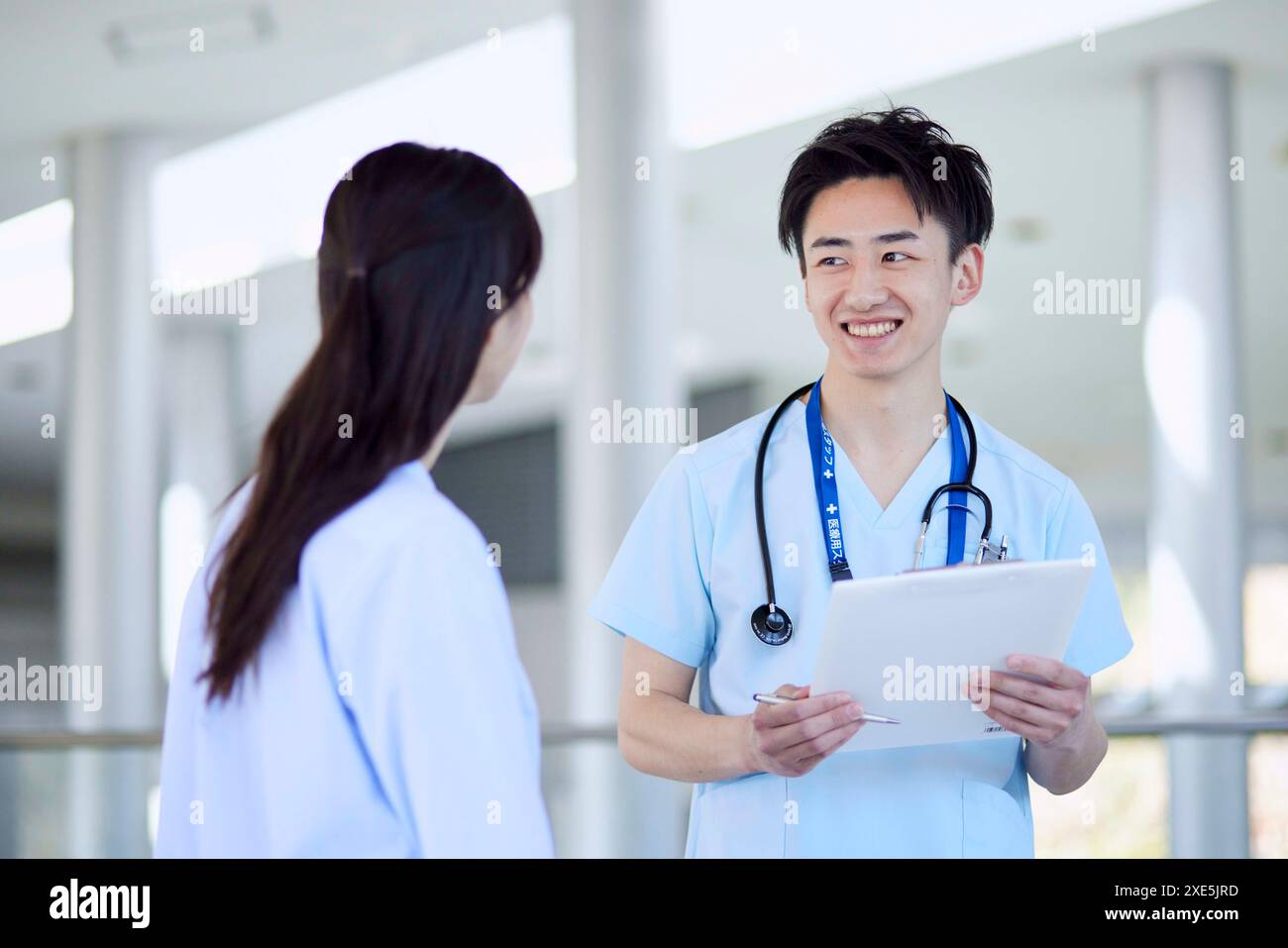 Female patient smiling doctor hi-res stock photography and images - Alamy