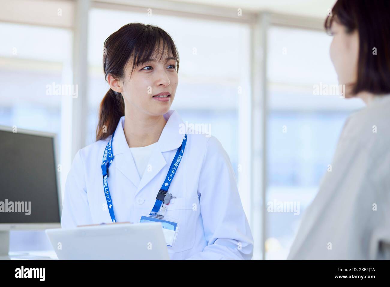 Patient and doctor in the examination room Stock Photo - Alamy