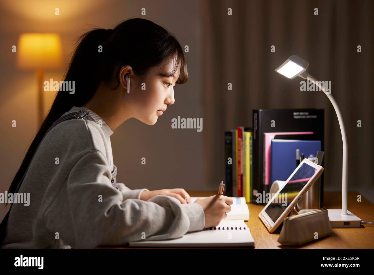 High school girl studying for an exam in her room Stock Photo - Alamy