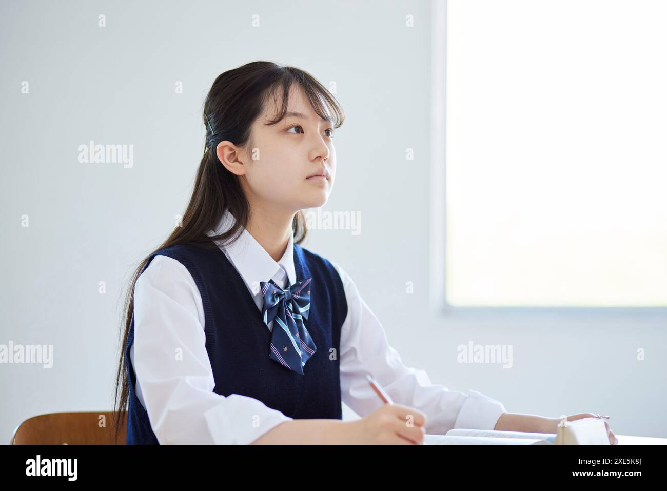 Female high school student taking a class in a school classroom Stock ...