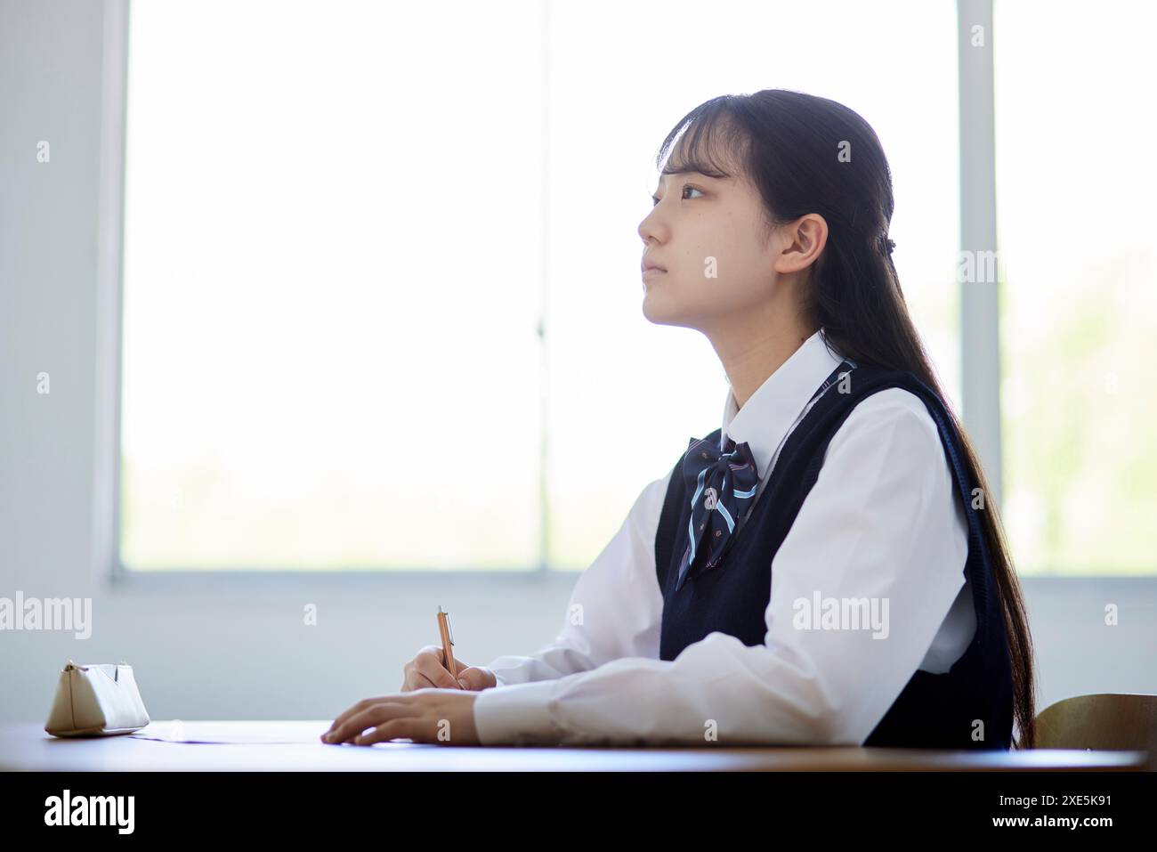 Female high school student taking a class in a school classroom Stock ...