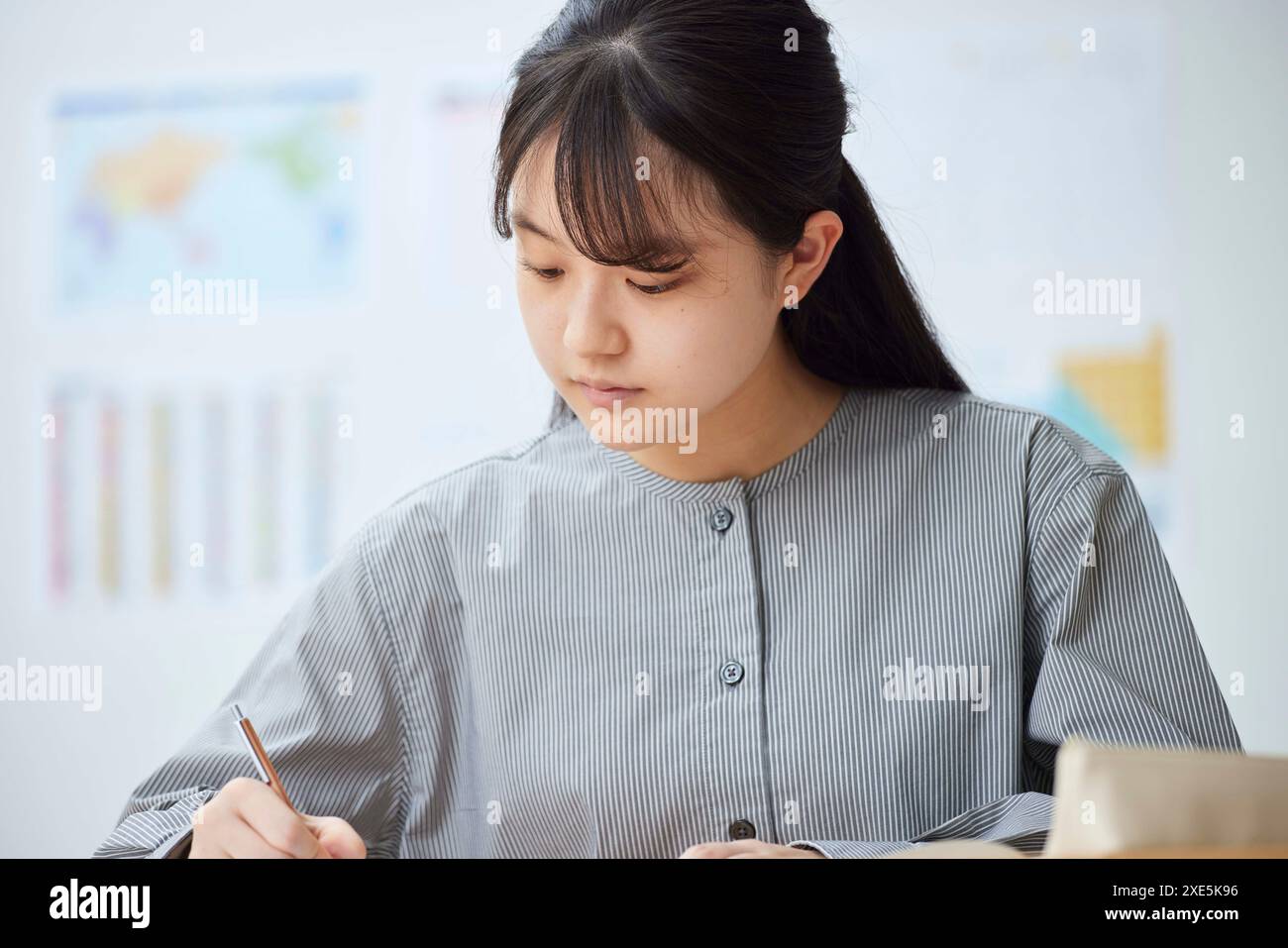Female high school student taking a class at a prep school Stock Photo ...