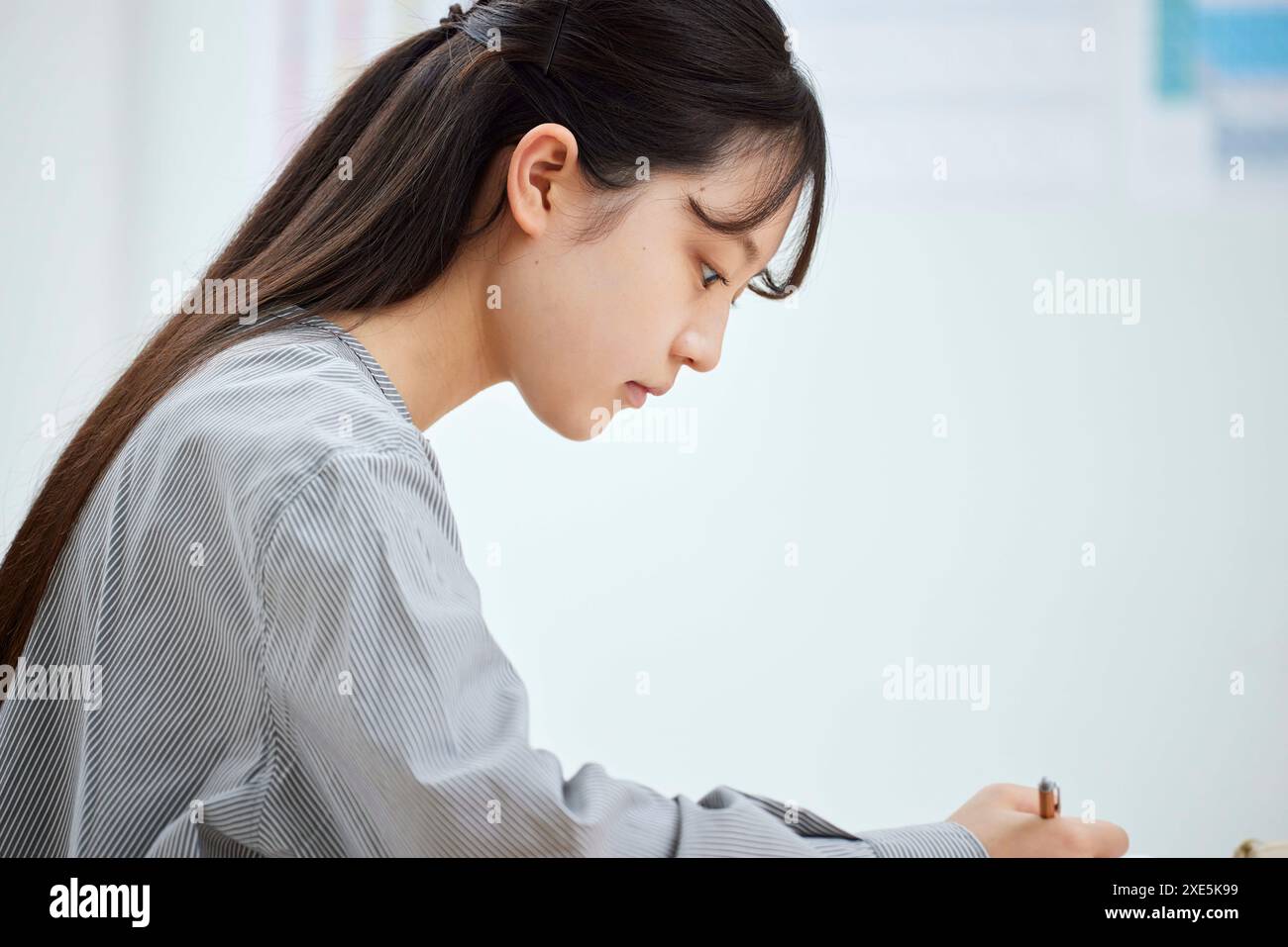 Female high school student taking a class at a prep school Stock Photo ...