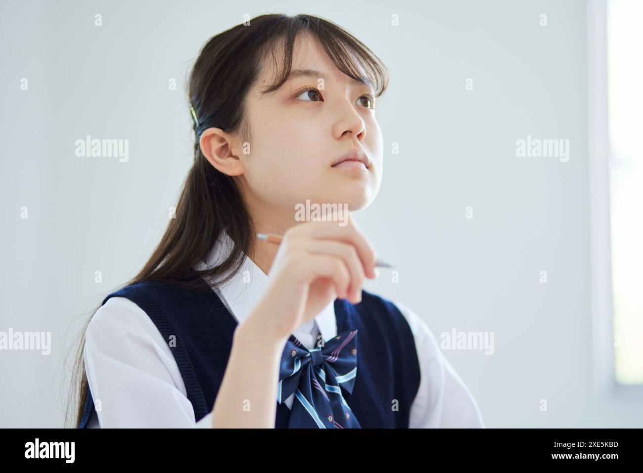 Female high school student taking a class in a school classroom Stock ...