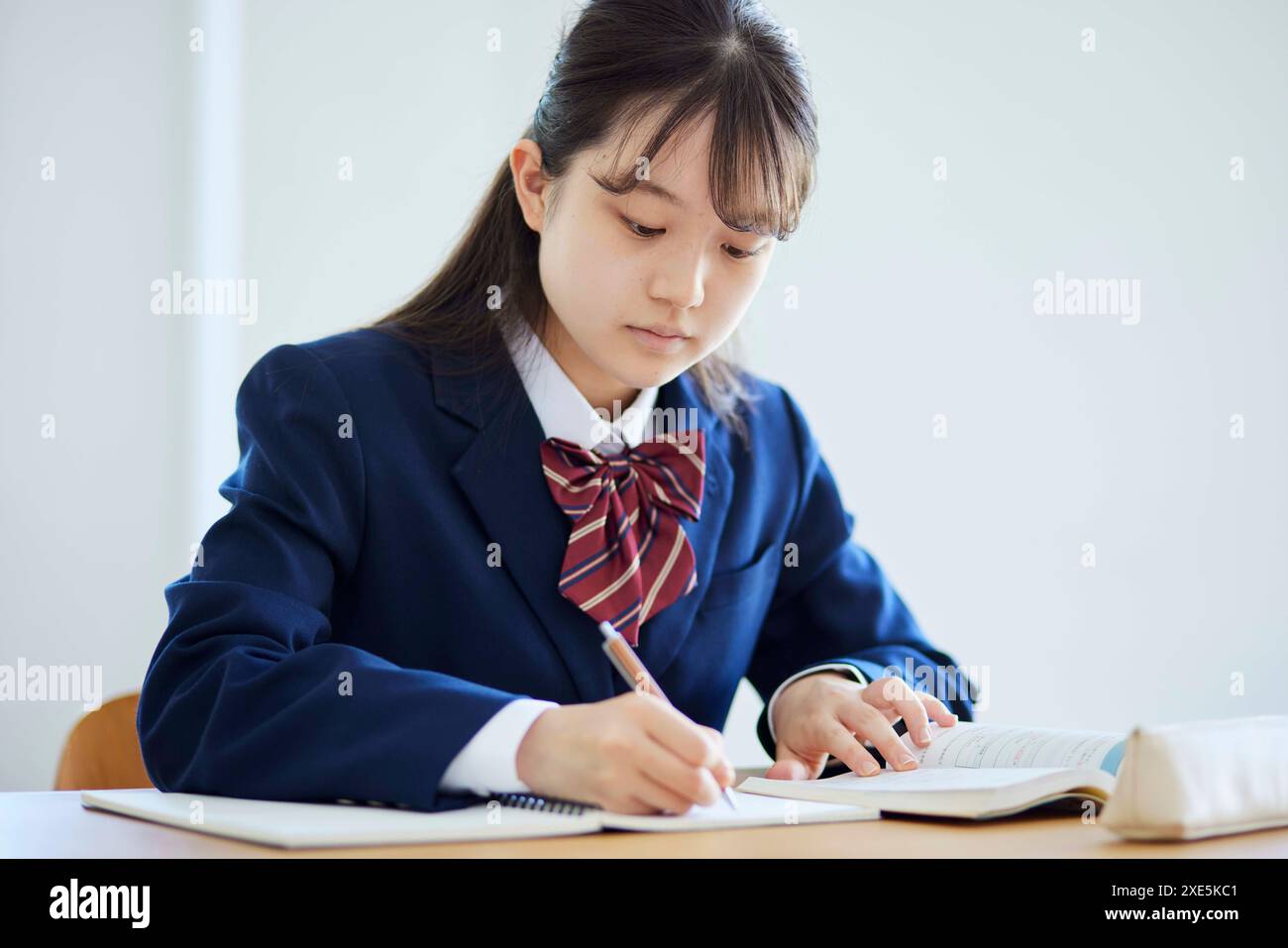 Female high school student taking a class in a school classroom Stock ...