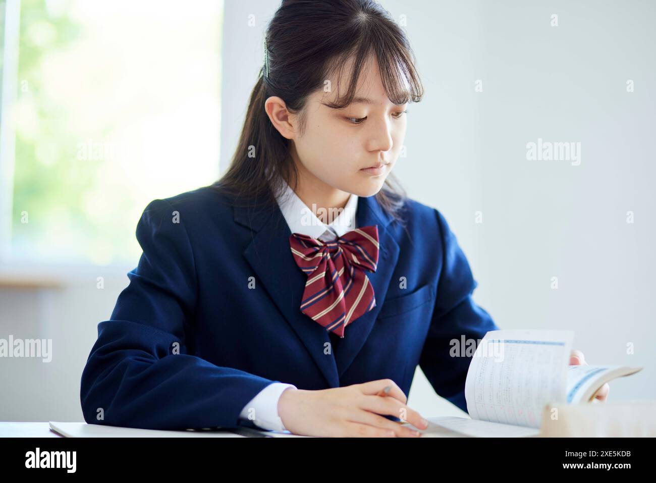 Female high school student taking a class in a school classroom Stock ...