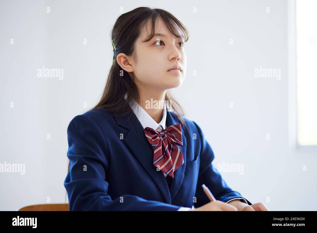 Female high school student taking a class in a school classroom Stock Photo - Alamy