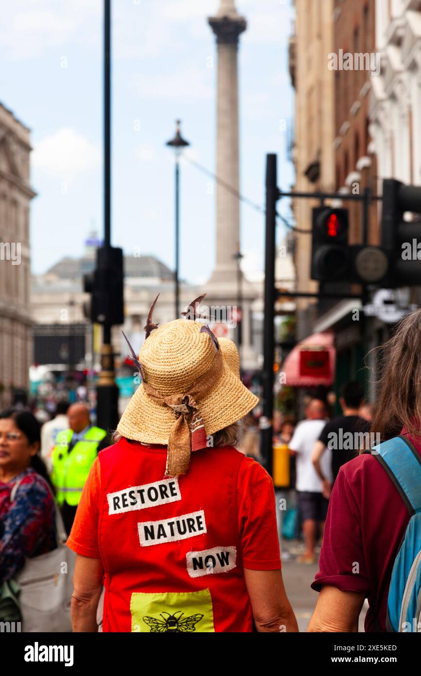 A Restore Nature Now campaigner heads home towards Trafalgar Square ...