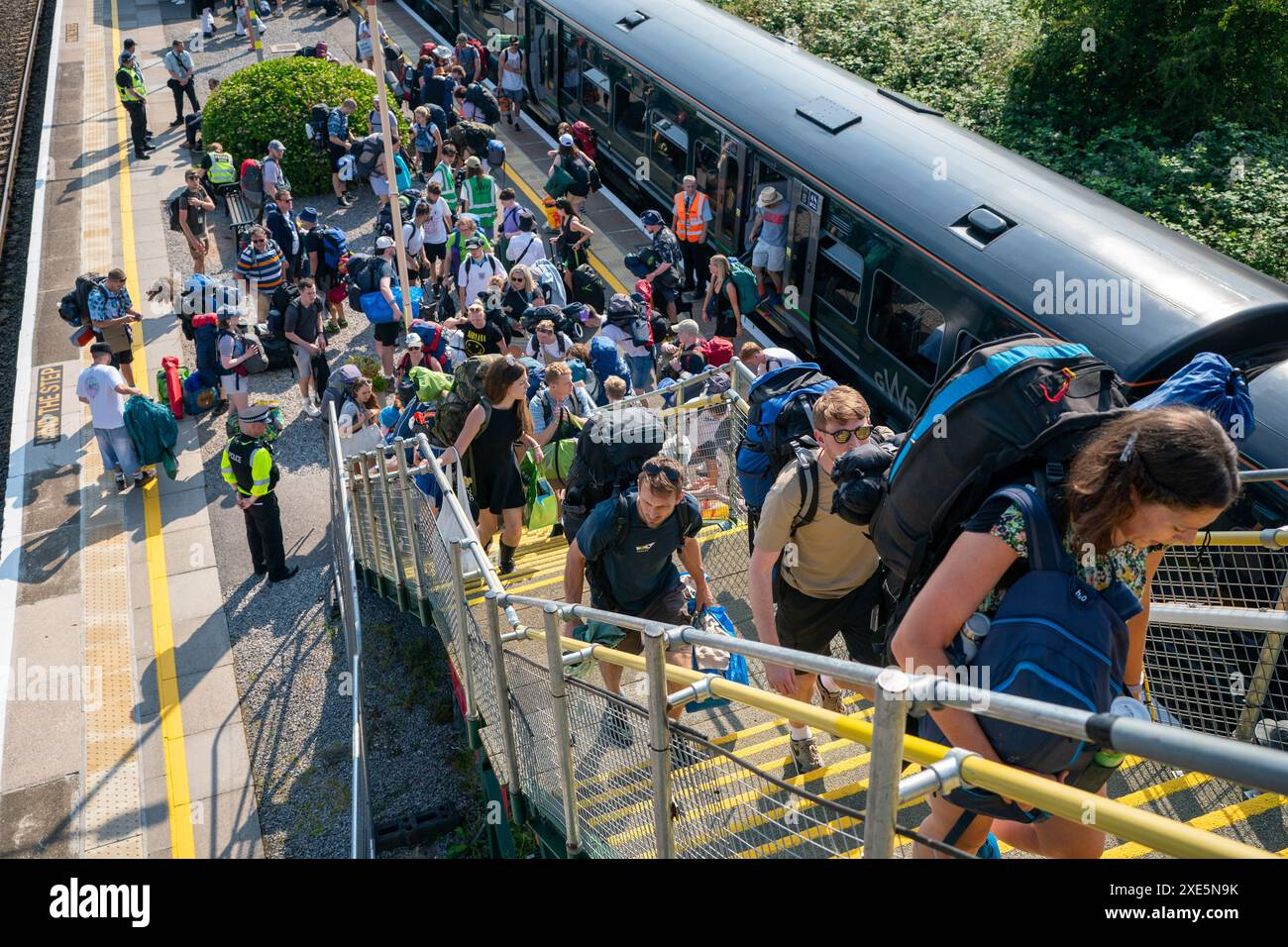 Revelers arrive at Castle Cary train station as they make their way off ...