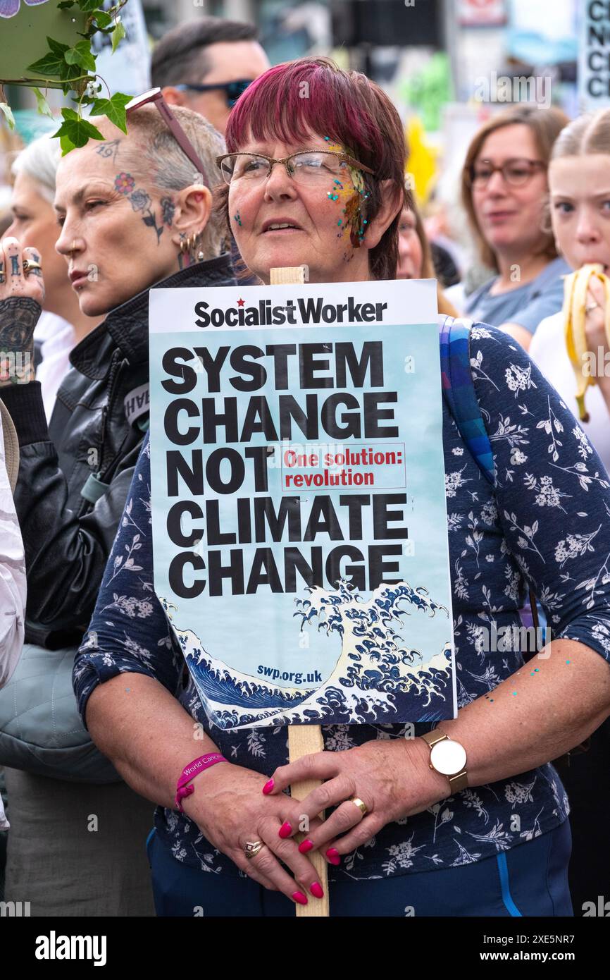 London, UK. 22nd June 2024. Environmental protester holding sign at the ...
