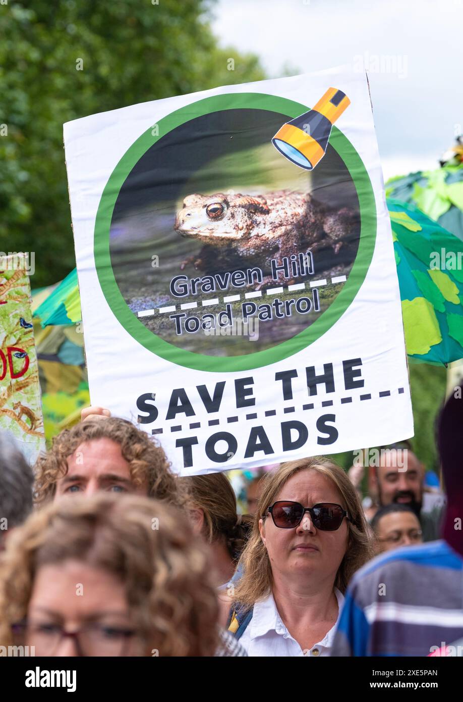 London, UK. 22nd June 2024. Environmental protester holding sign at the ...