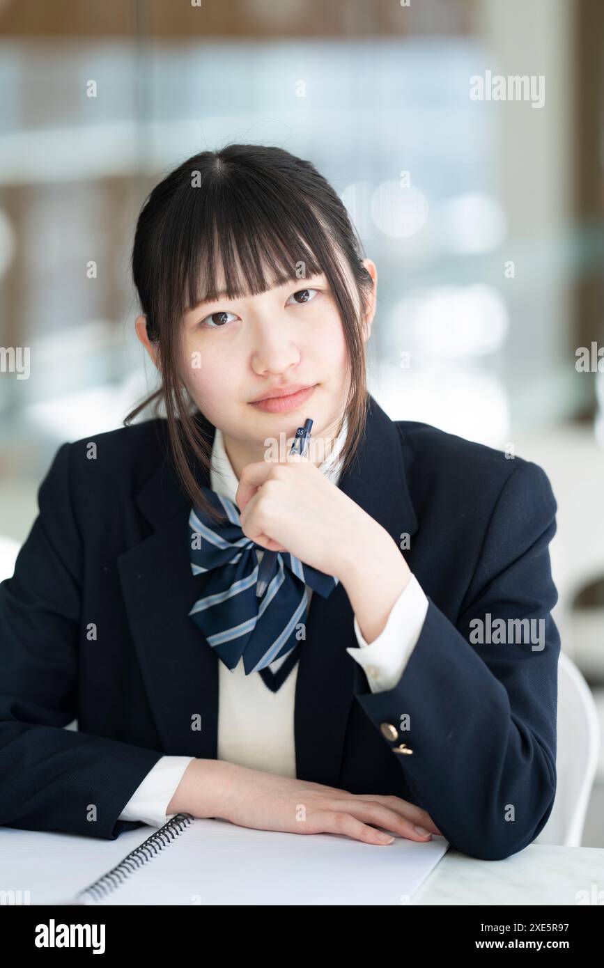 Schoolgirls in uniform studying Stock Photo - Alamy
