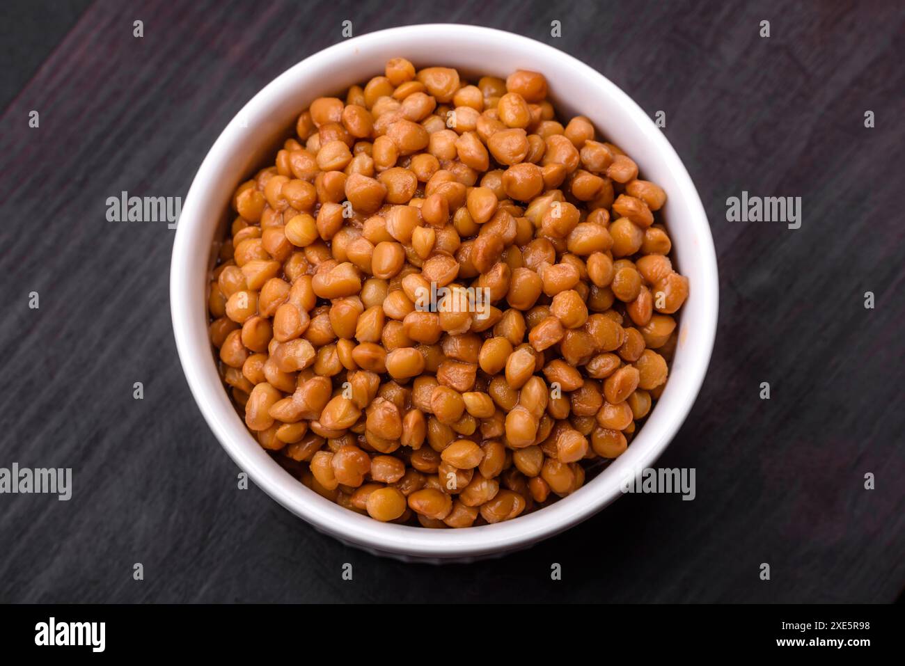 Delicious healthy canned lentils in a ceramic ribbed white bowl Stock ...