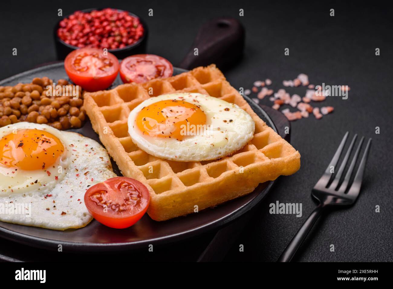 Delicious hearty breakfast consisting of a fried egg, Belgian waffle ...