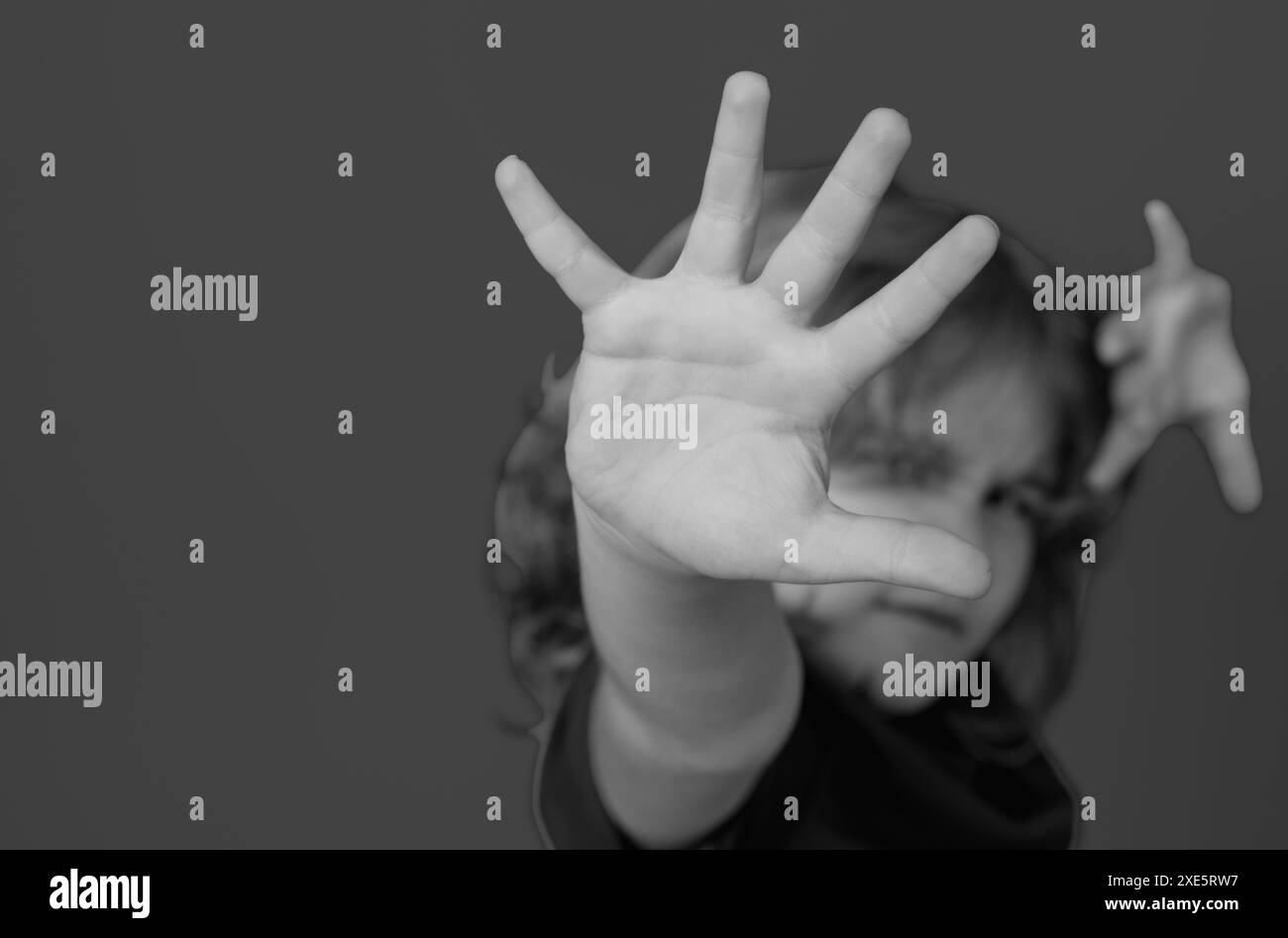 Child making stop gesture on yellow isolated studio background. Kid ...