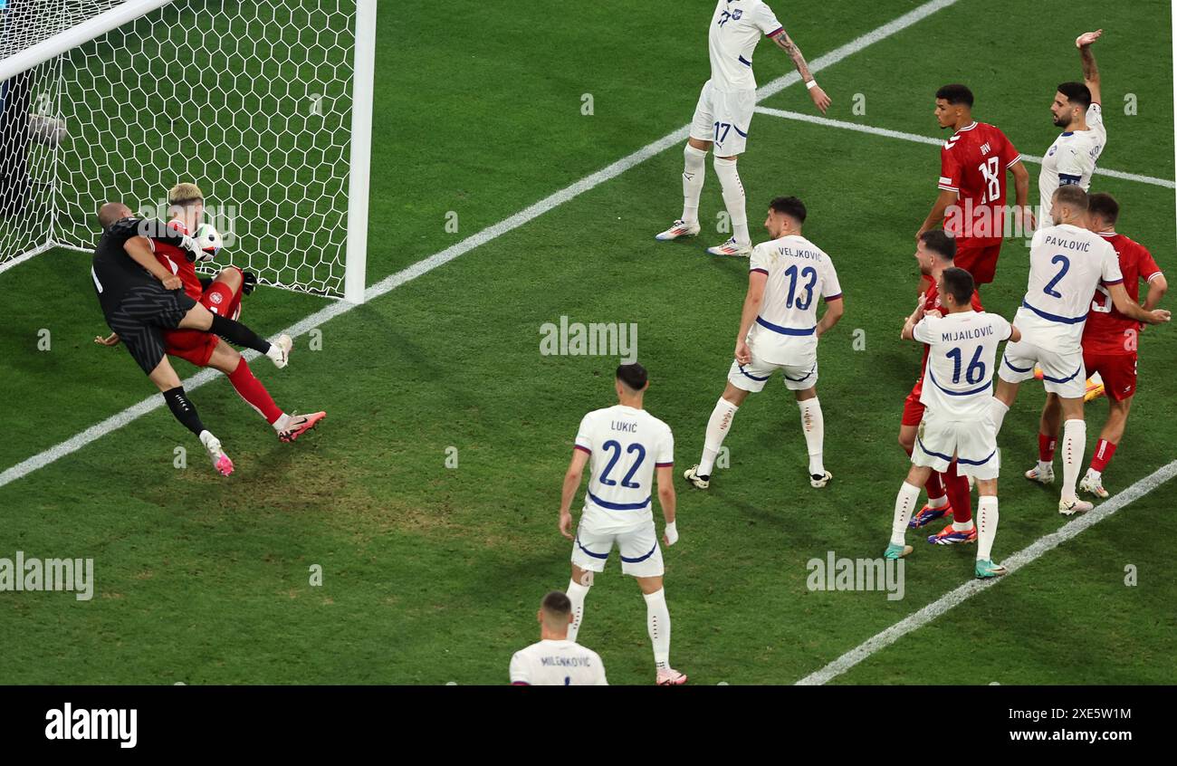 MUNICH, GERMANY - JUNE 25: Jonas Wind of Denmark vies with Predrag ...