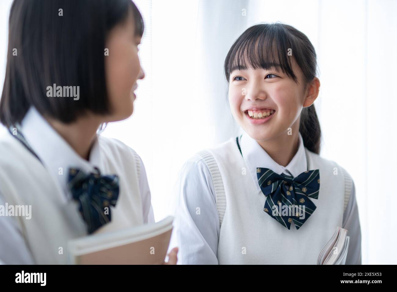 Student chatting with others Stock Photo - Alamy