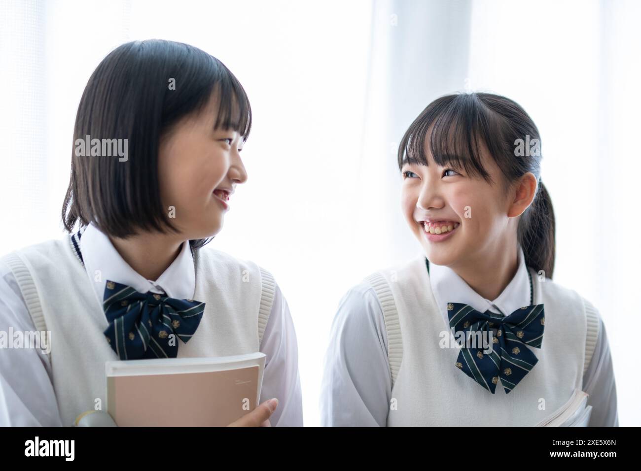 Student chatting with others Stock Photo - Alamy