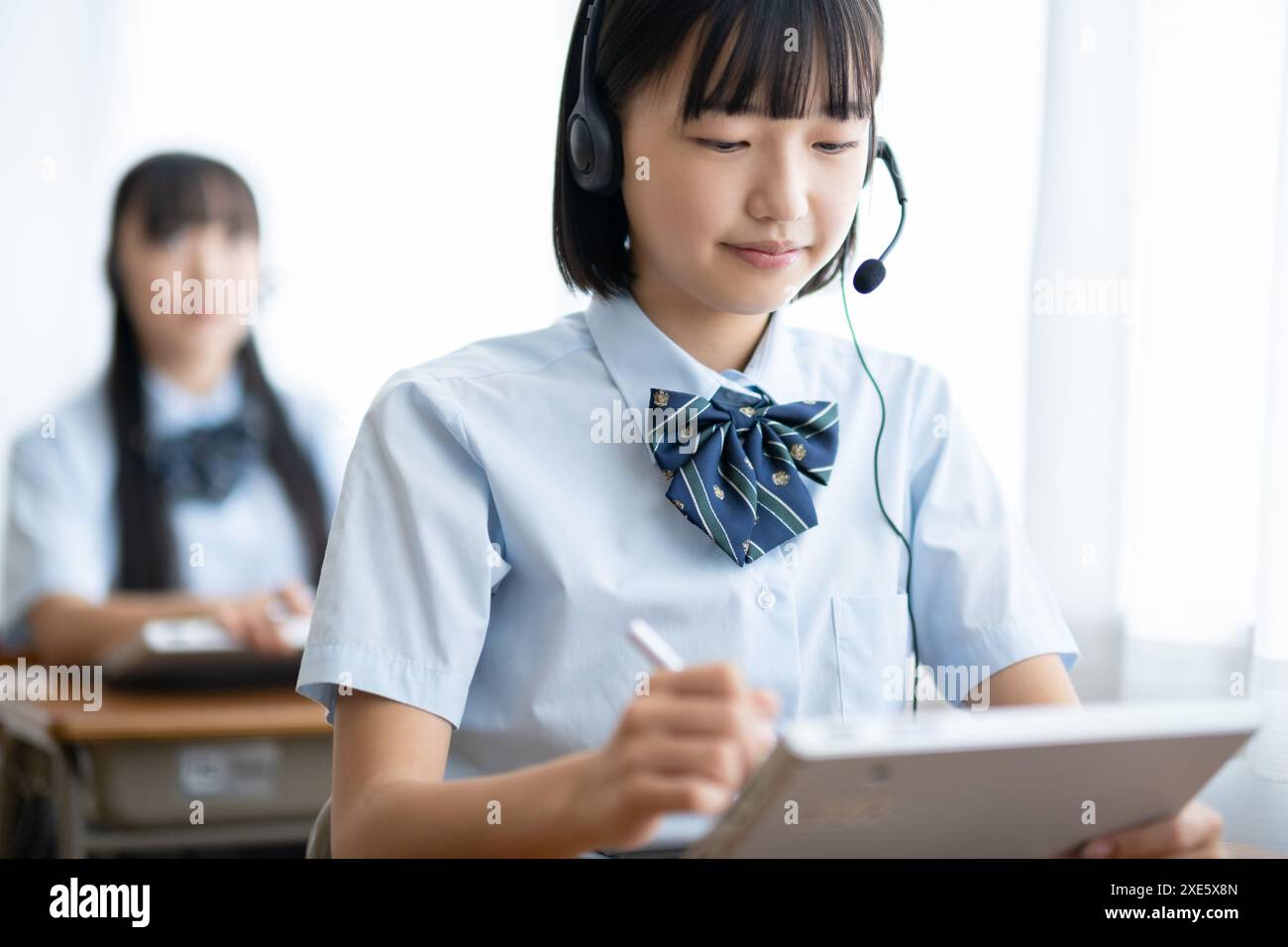 Student taking a class using a tablet Stock Photo - Alamy