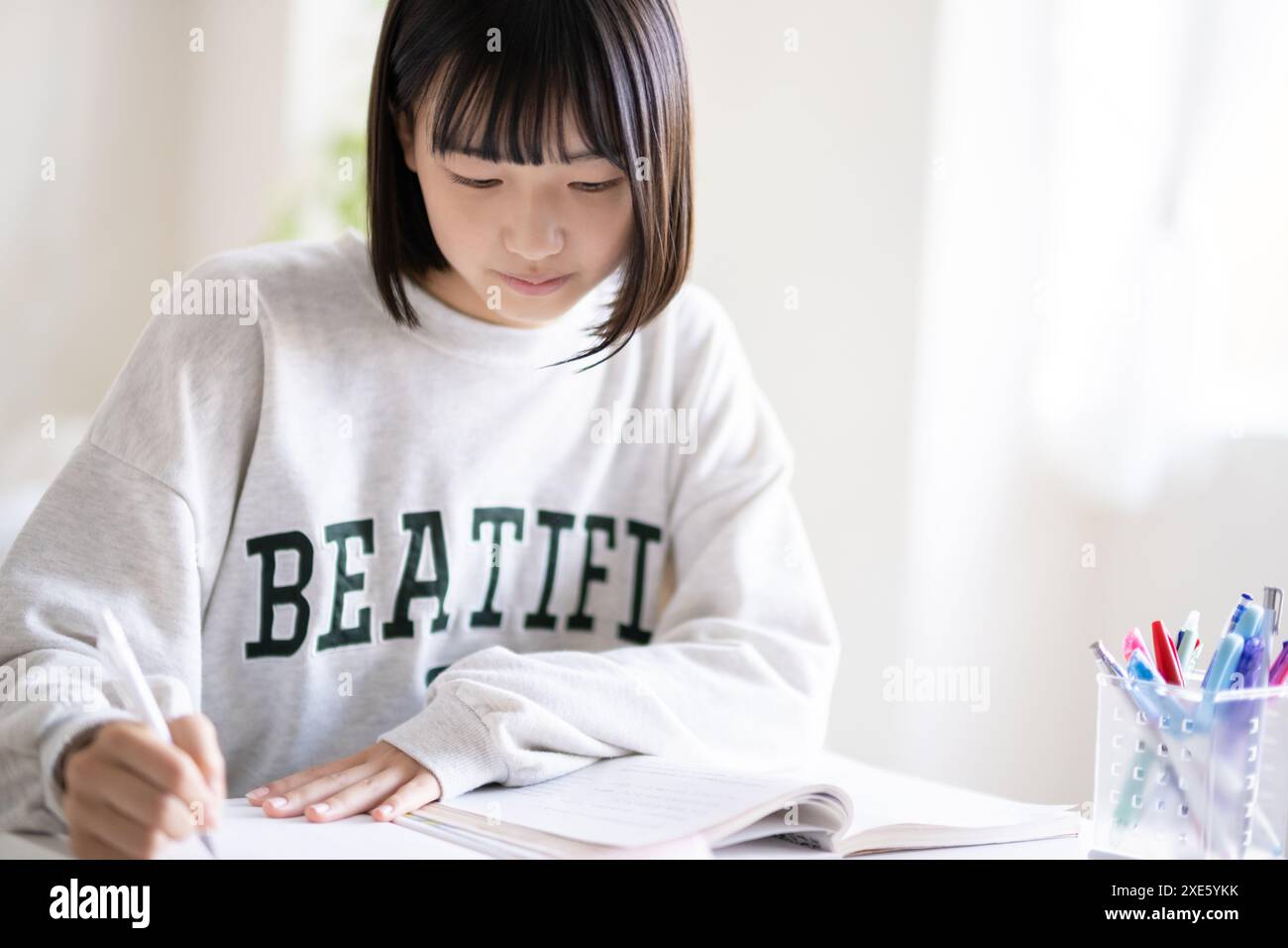 Student studying at home Stock Photo - Alamy