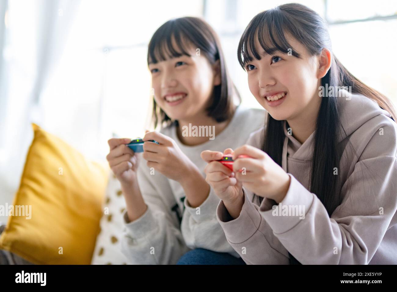 Girl playing a game Stock Photo - Alamy