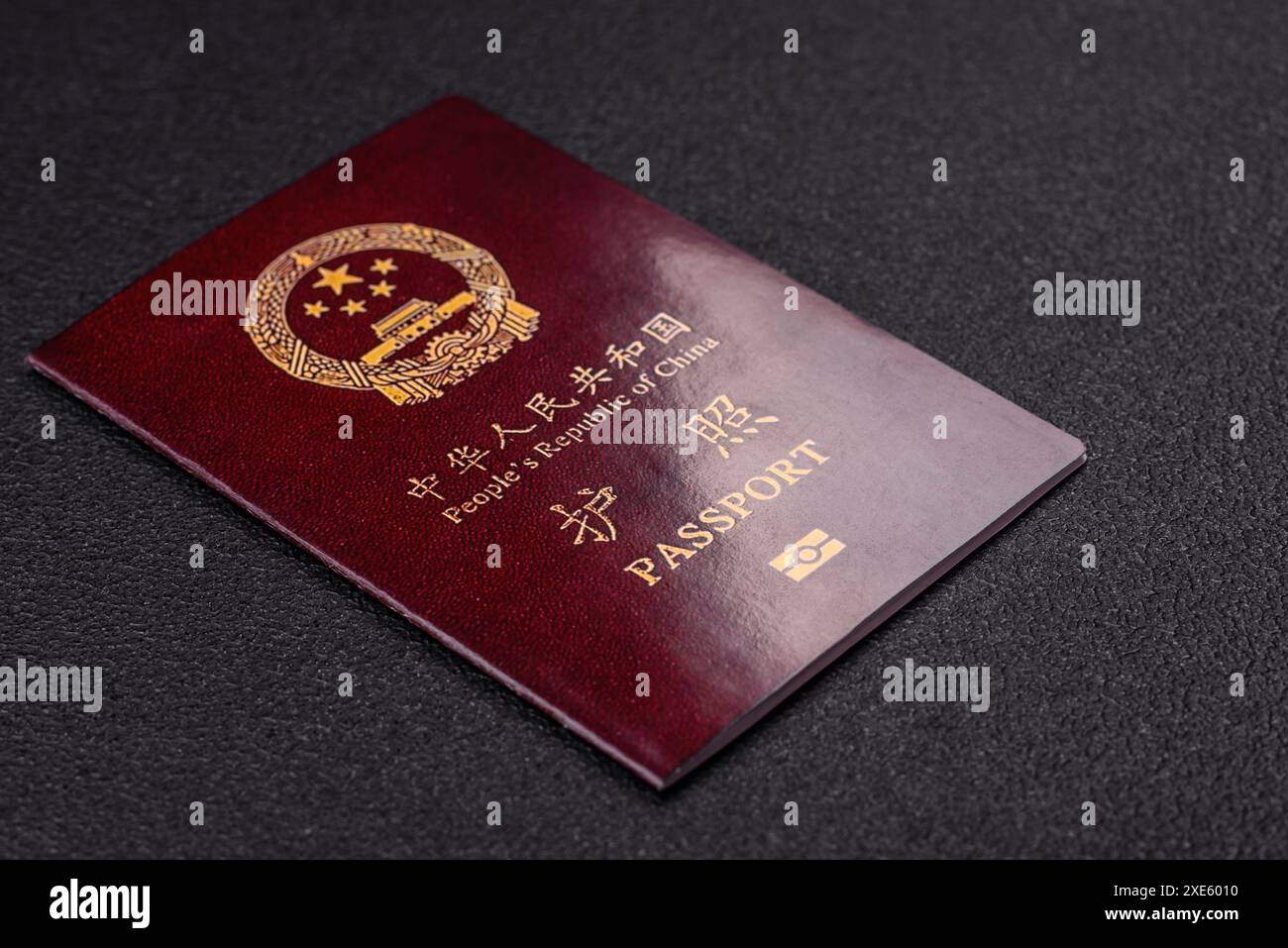 Physical paper international passport of a Chinese citizen on a dark ...