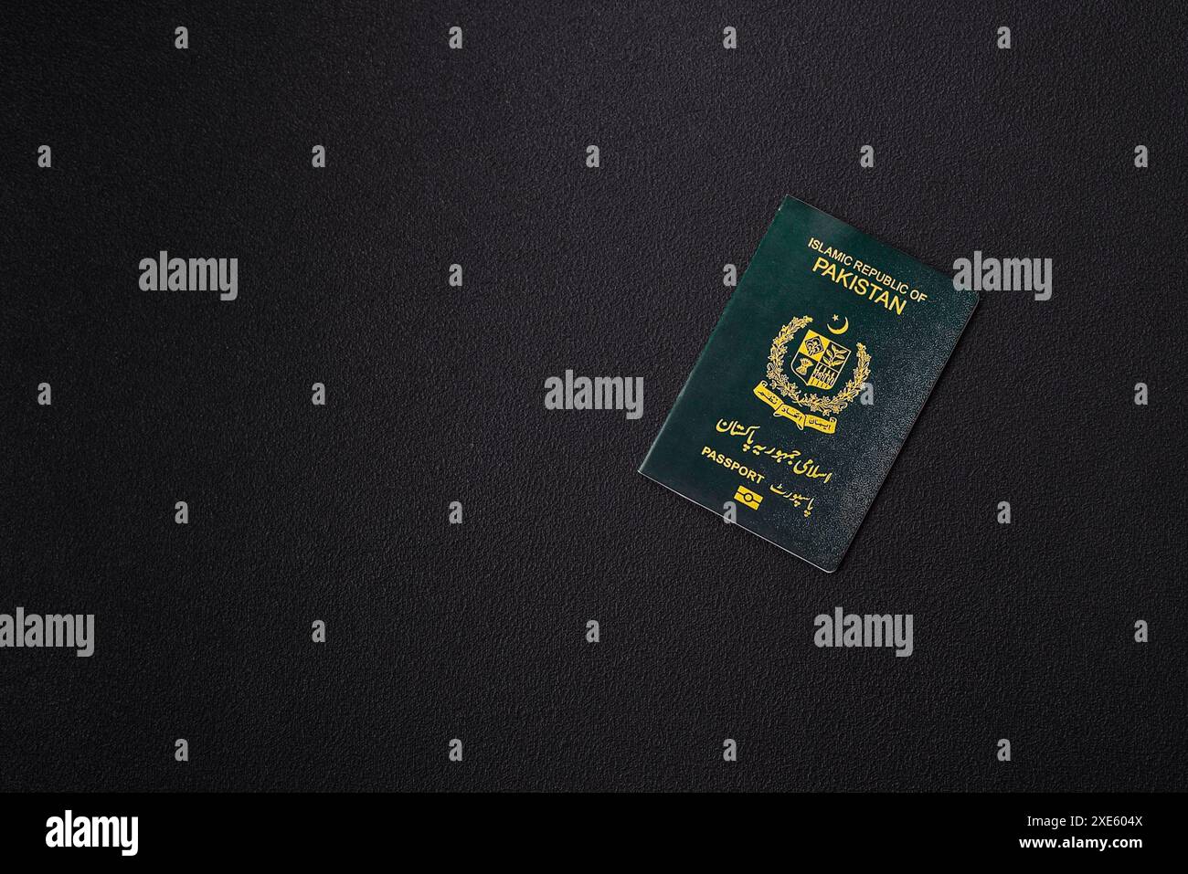 Physical paper international passport of Pakistani citizen on dark ...