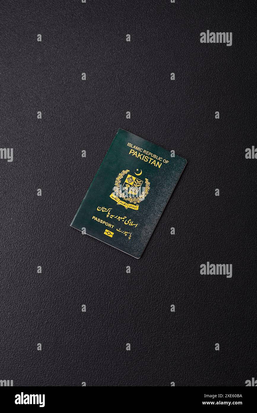 Physical paper international passport of Pakistani citizen on dark ...