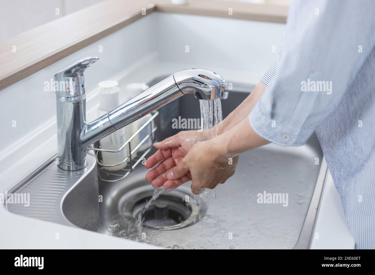 Man washing his hands Stock Photo - Alamy