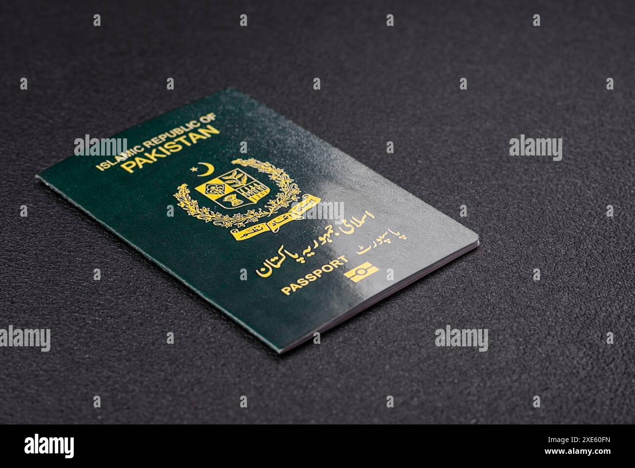 Physical paper international passport of Pakistani citizen on dark ...
