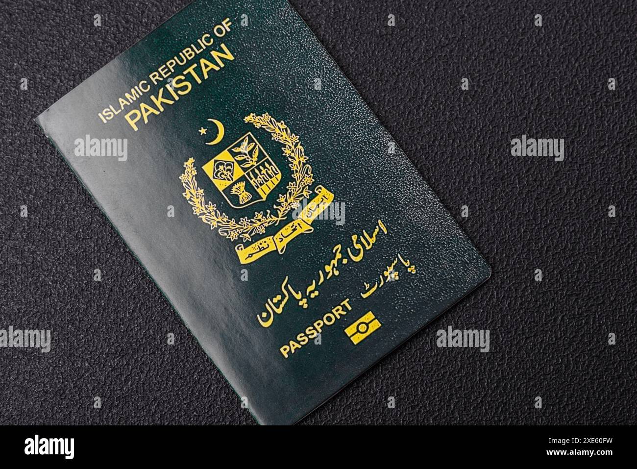 Physical paper international passport of Pakistani citizen on dark ...