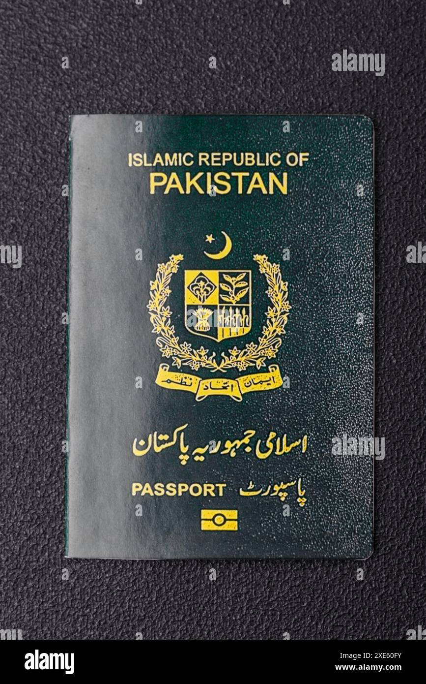 Physical paper international passport of Pakistani citizen on dark ...