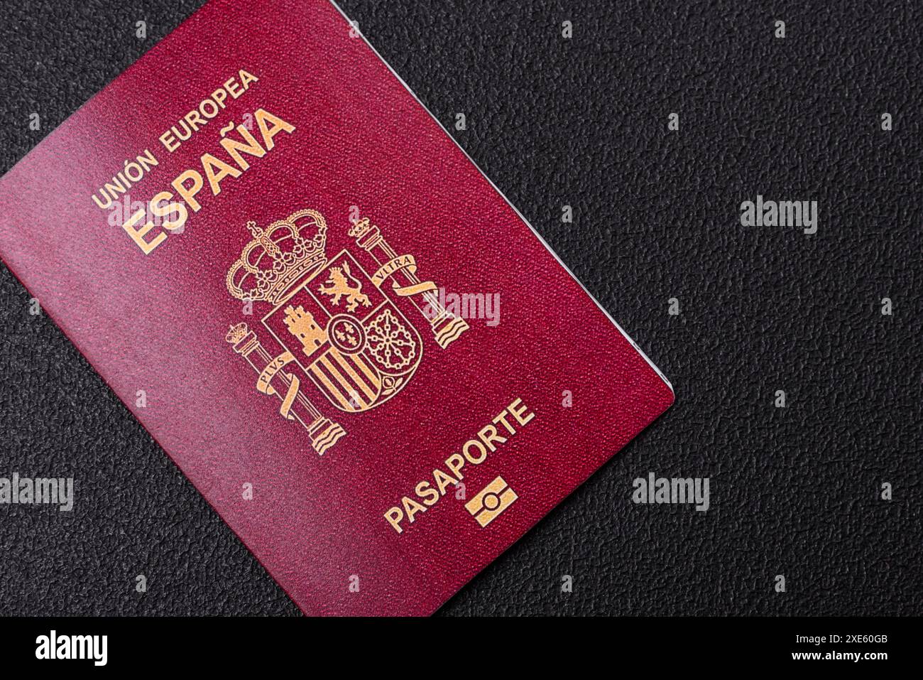 Physical paper international passport of a Spanish citizen on a dark ...