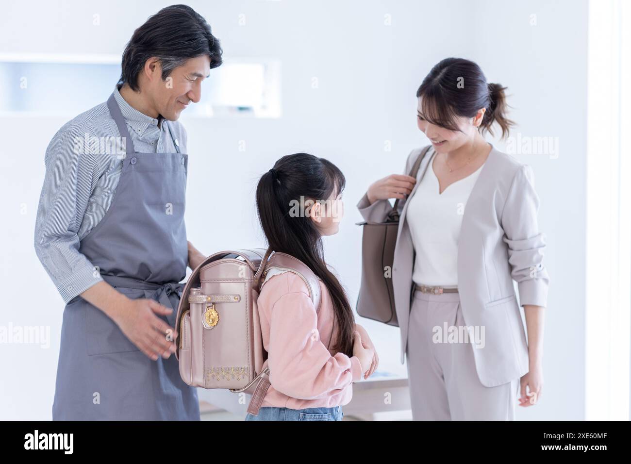 Family getting ready for school Stock Photo - Alamy