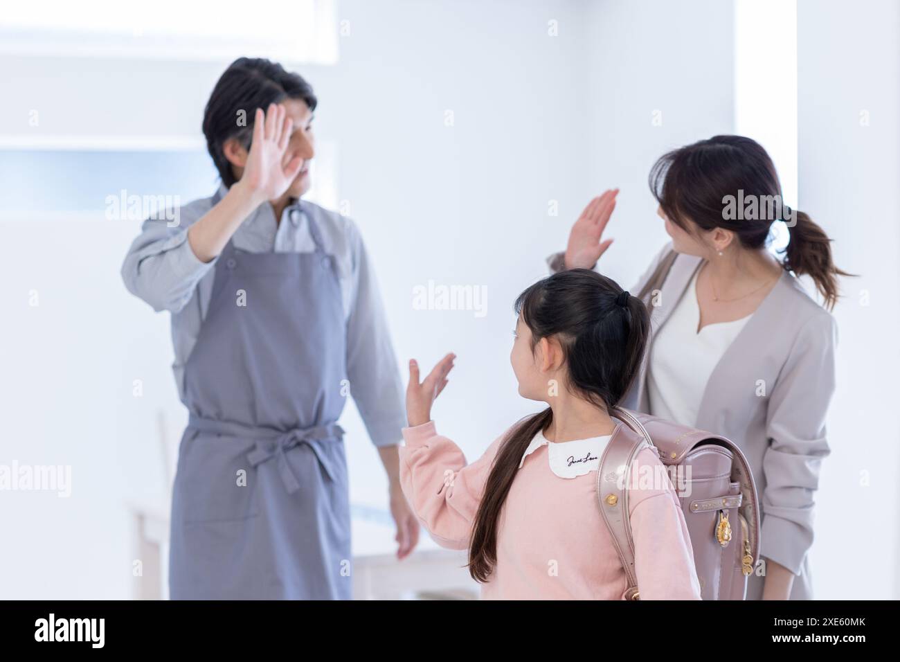 Family getting ready for school Stock Photo - Alamy