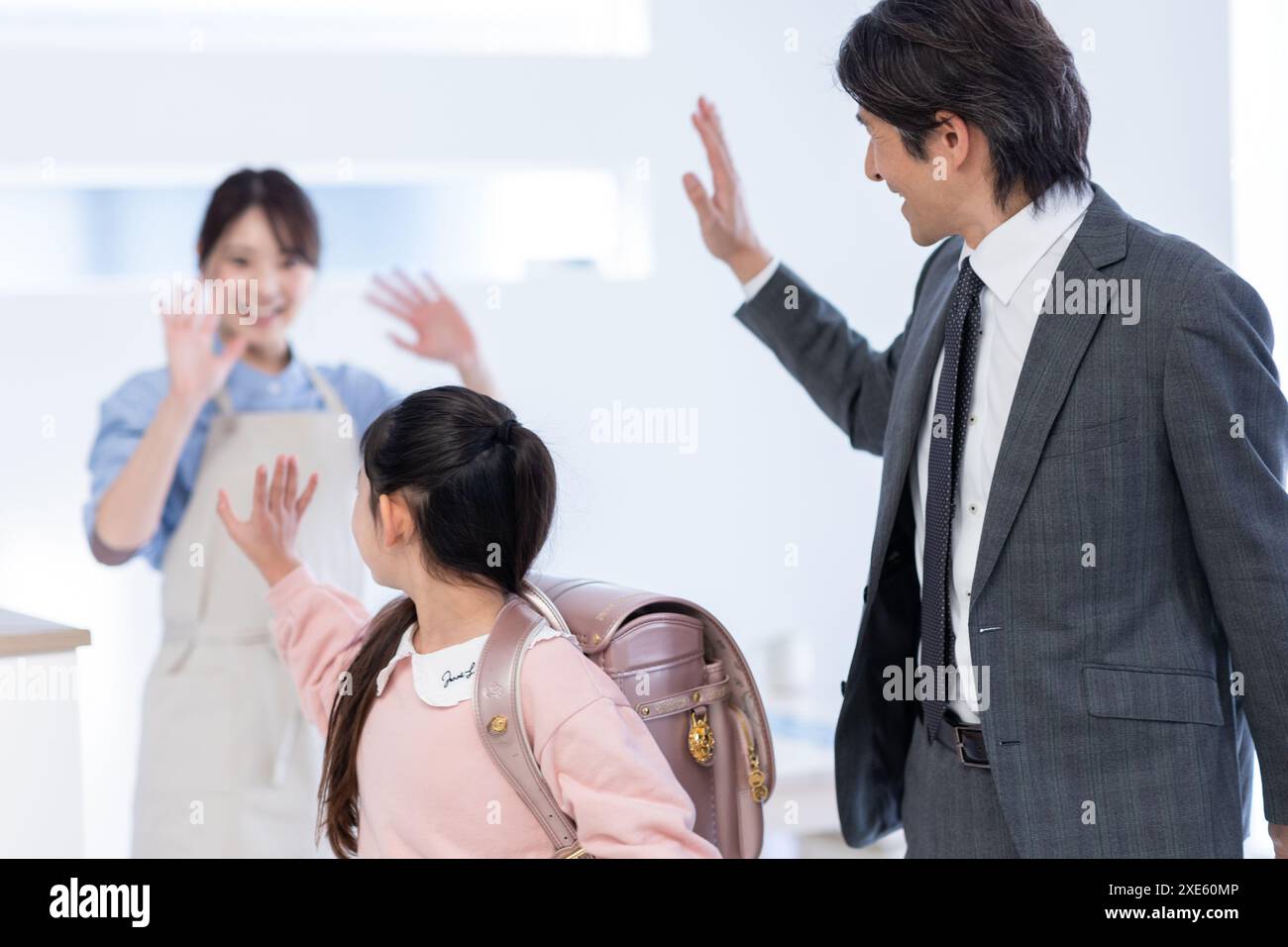 Family waving hands Stock Photo - Alamy