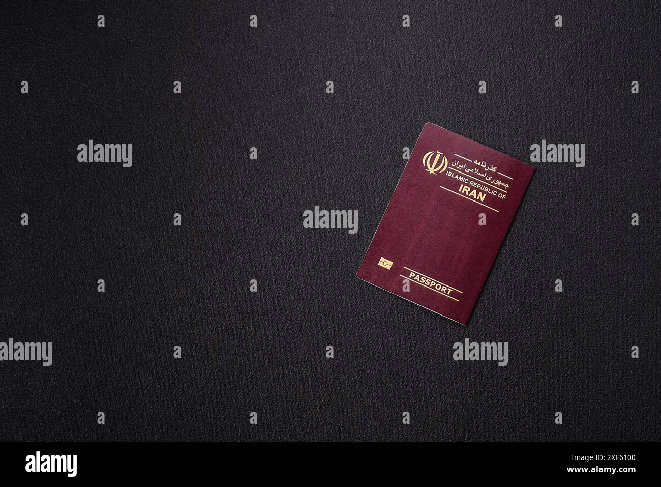 Physical paper international passport of Iranian citizen on dark ...