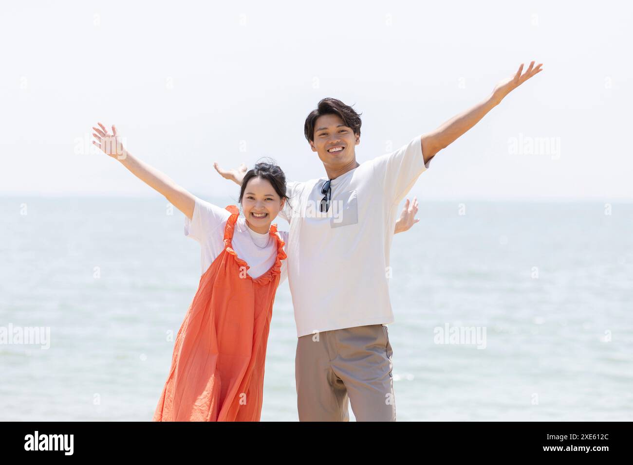 Man and woman frolicking in the sea Stock Photo - Alamy