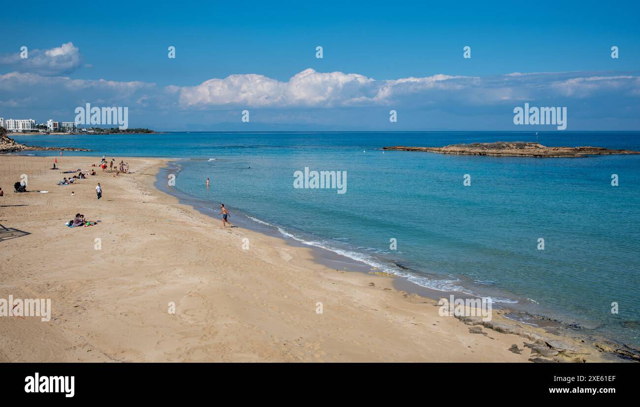 Tourist people enjoying the sandy beach relaxing, sunbathe swimming in ...