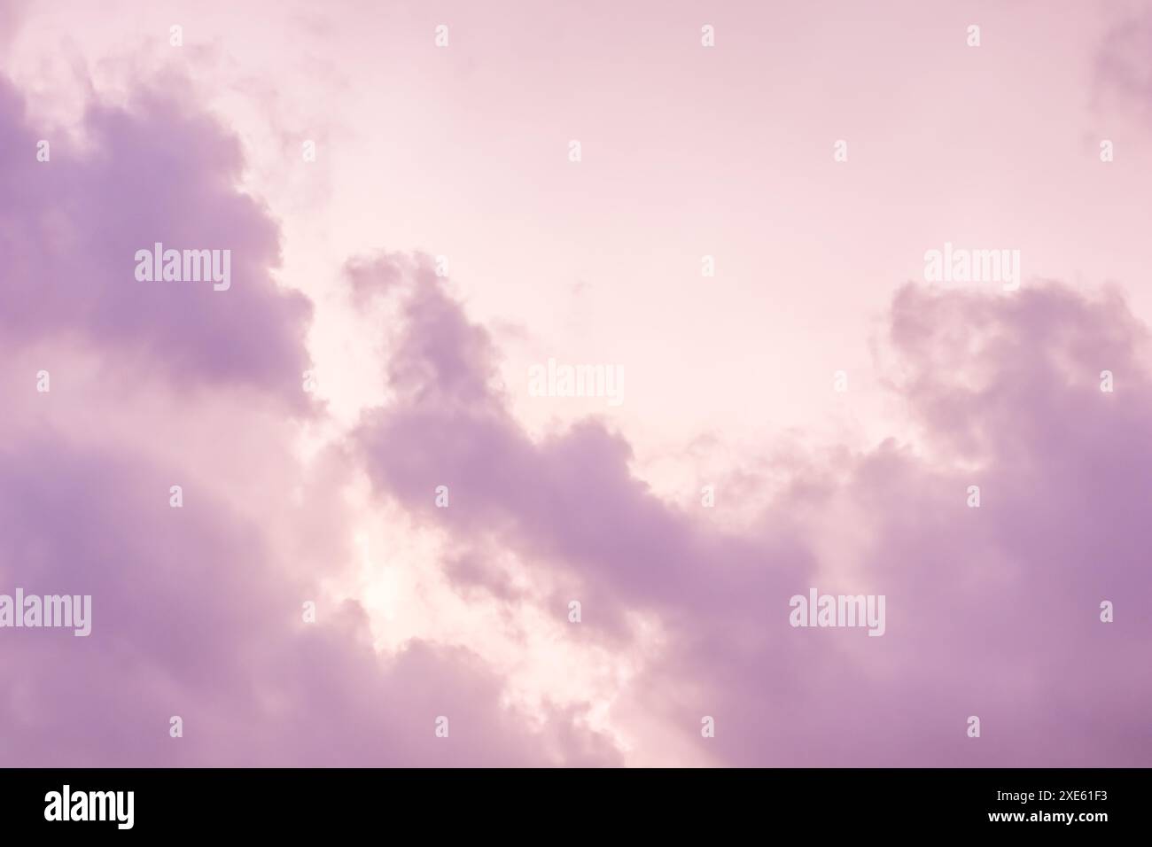 Background of a beautiful pink and pale purple sky with clouds at ...