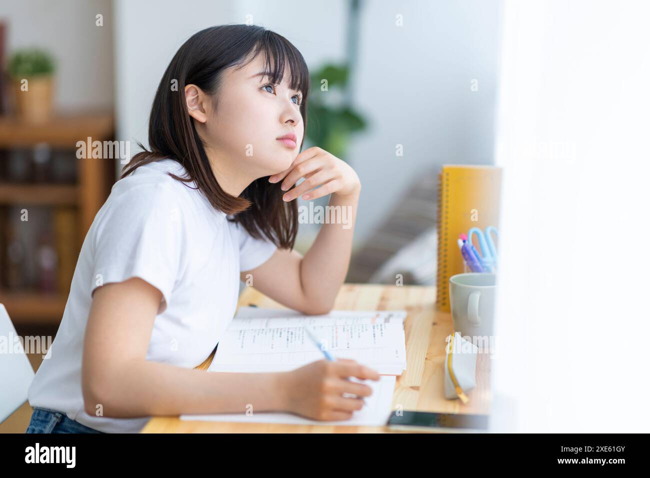 Student studying at home Stock Photo - Alamy