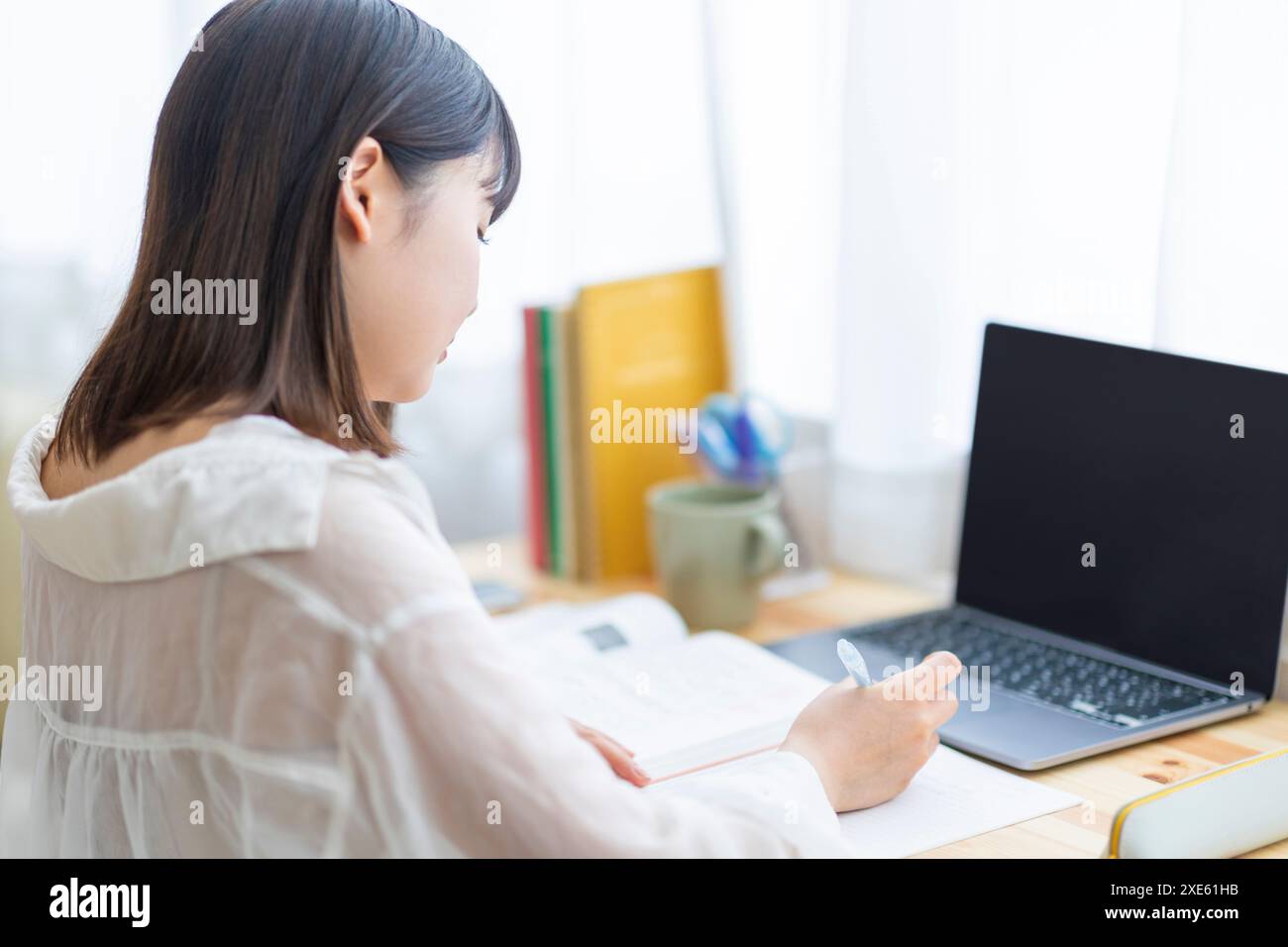 Student studying at home Stock Photo - Alamy