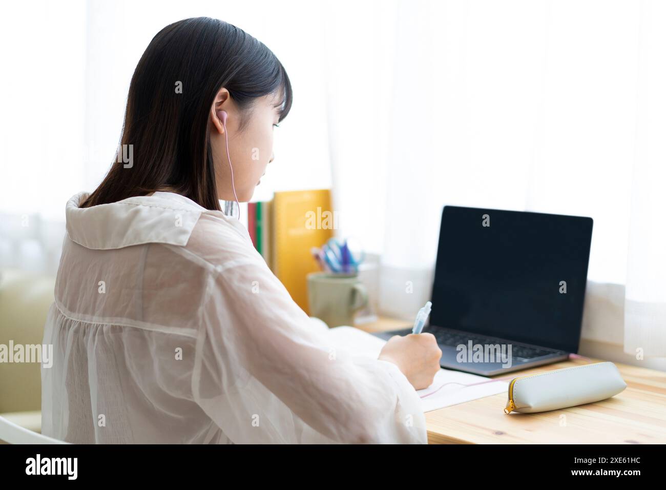 Student studying on computer Stock Photo - Alamy