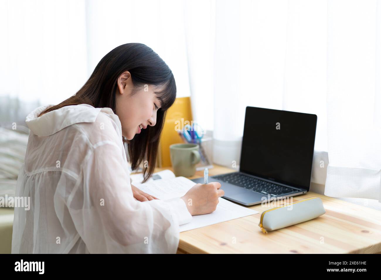 Student studying at home Stock Photo - Alamy