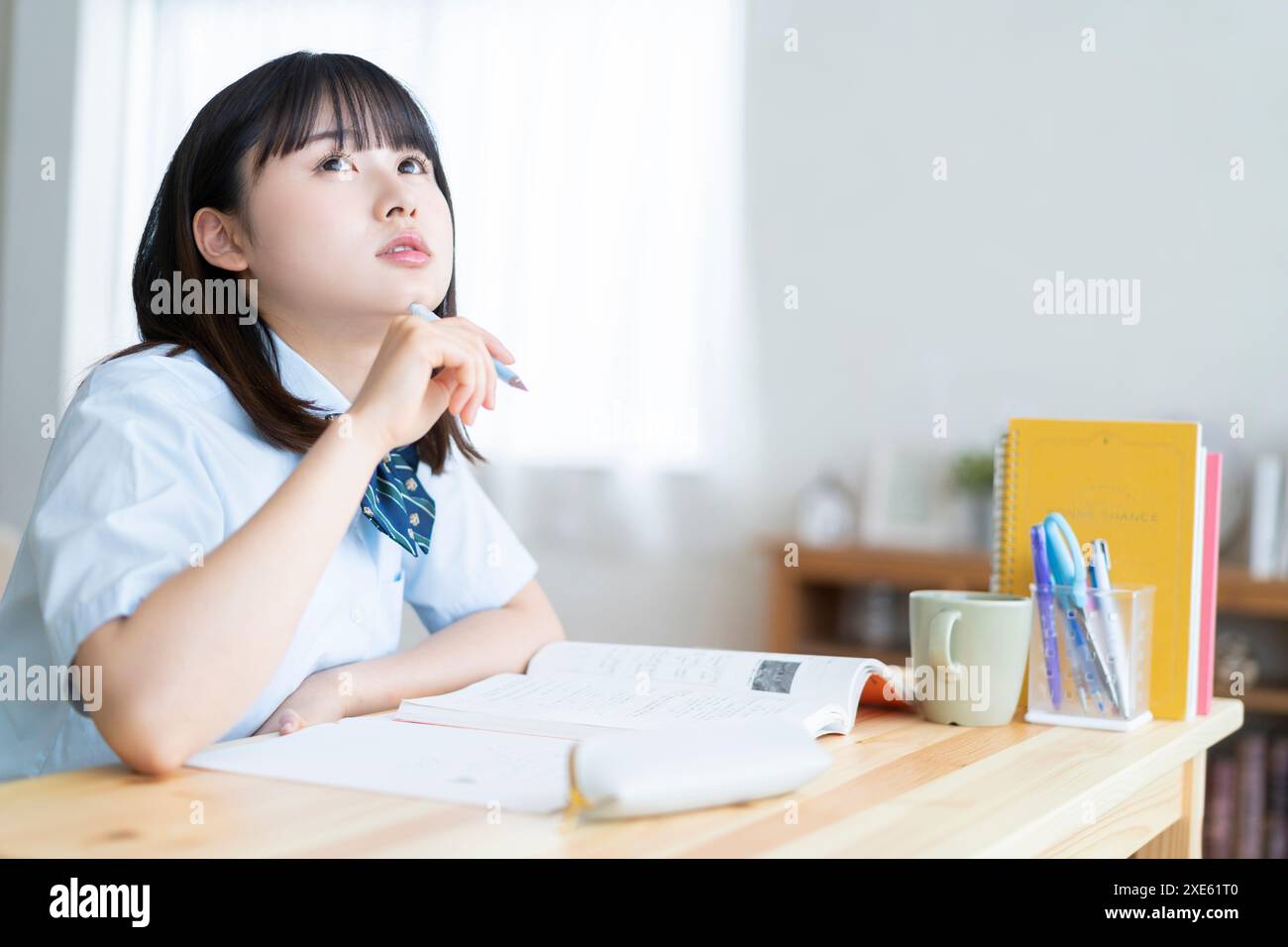 Student studying at home Stock Photo - Alamy