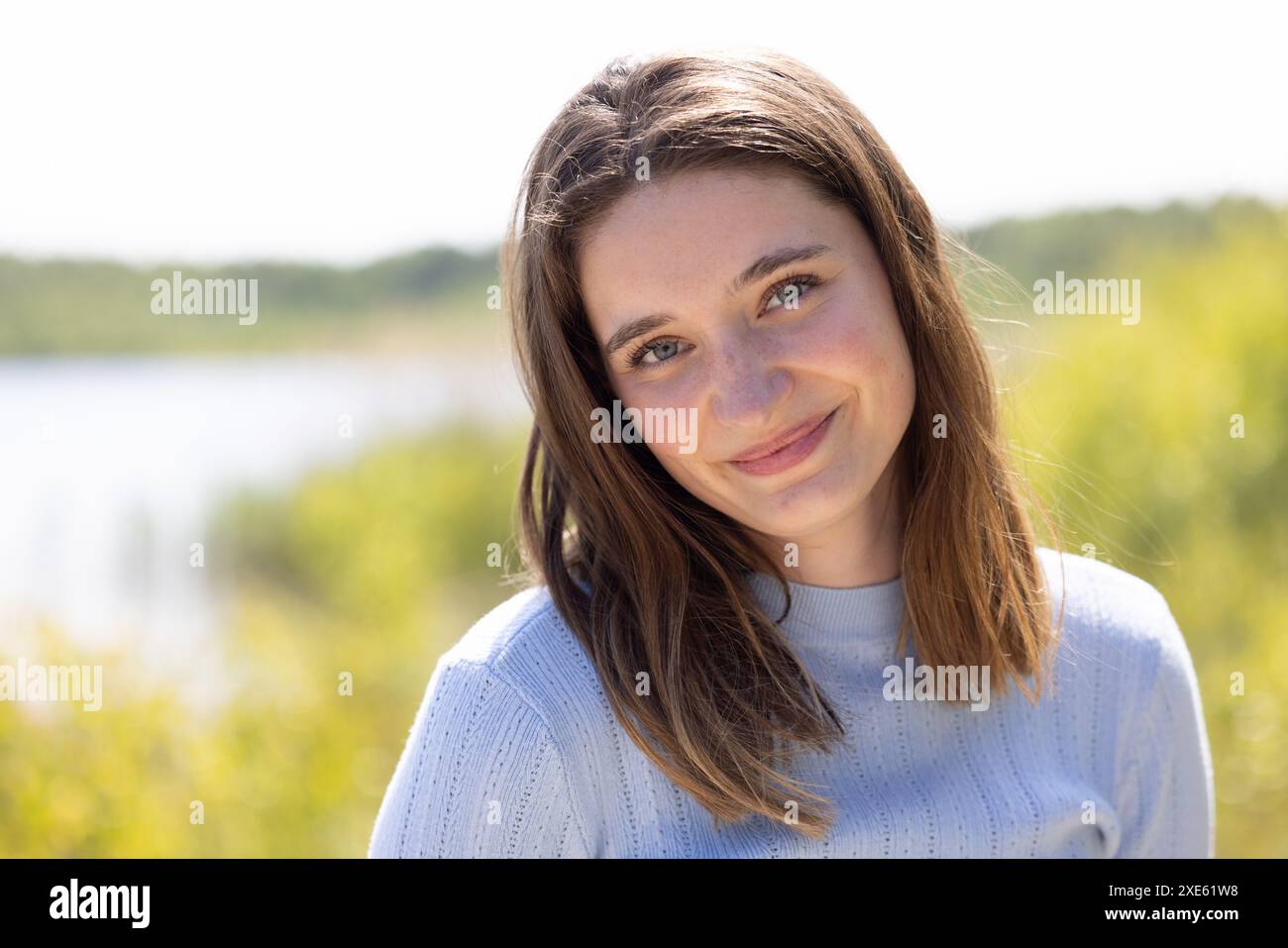 Portrait casual young woman inviting hi-res stock photography and ...