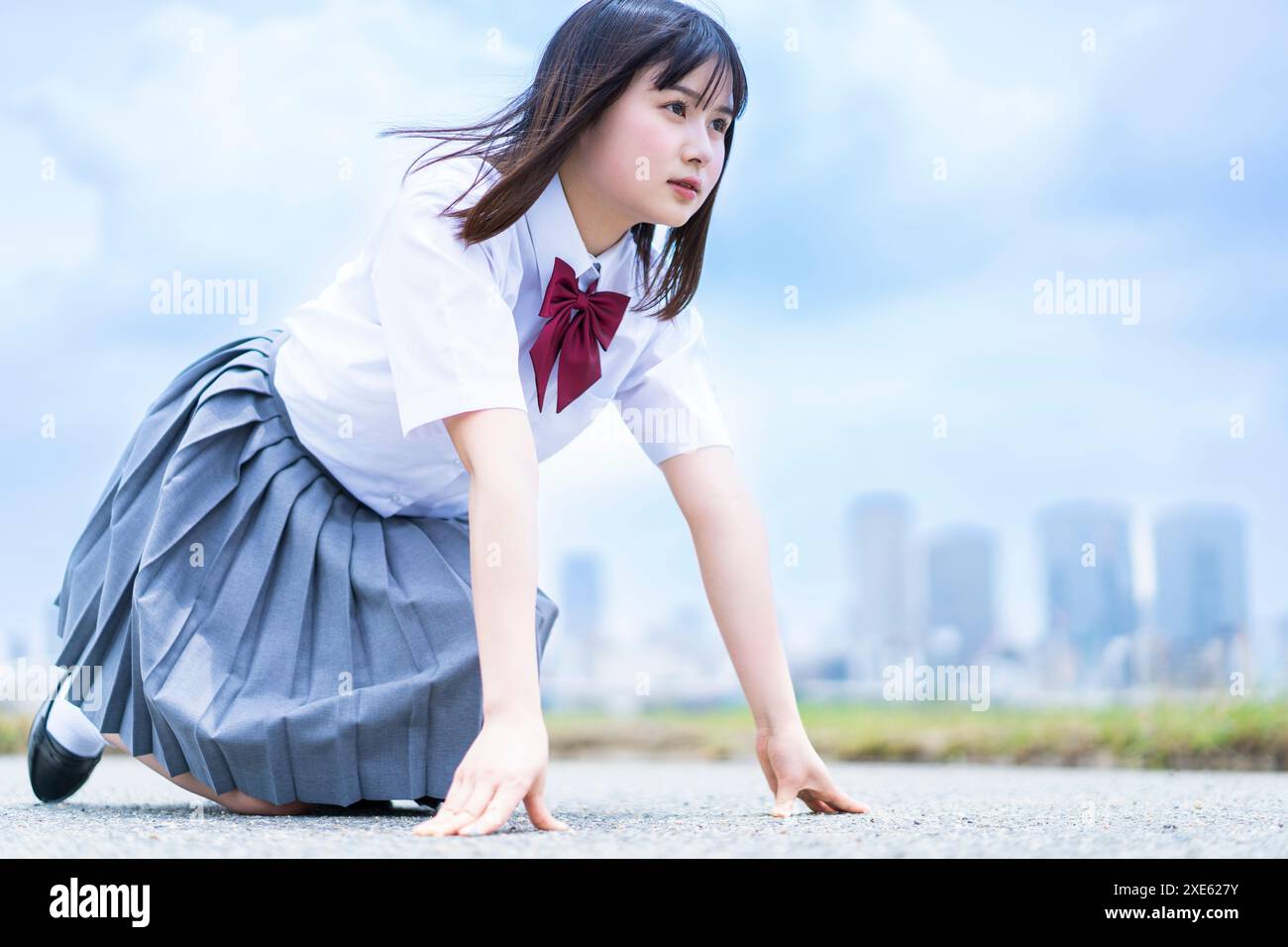 High school girl holding the camera Stock Photo - Alamy