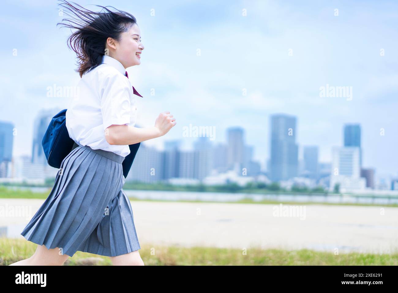 High school students running along the bank Stock Photo - Alamy