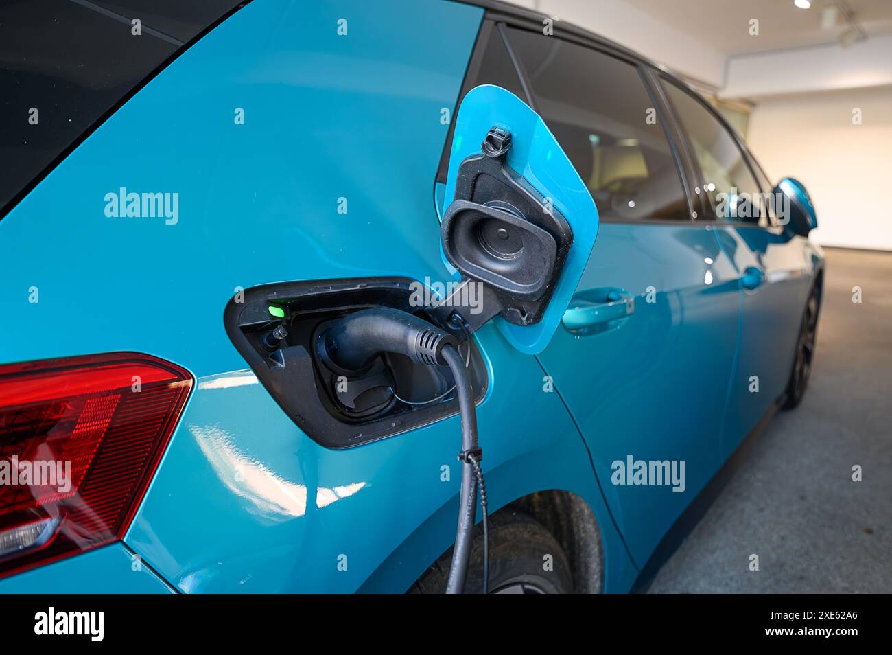 Electric car charging in underground garage home plugged charger ...