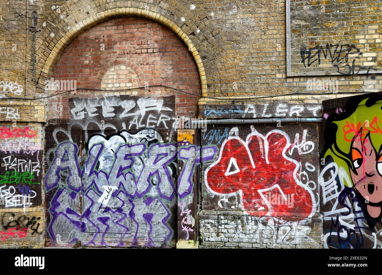 Graffiti on door on old railways arches close ot Waterloo Station ...